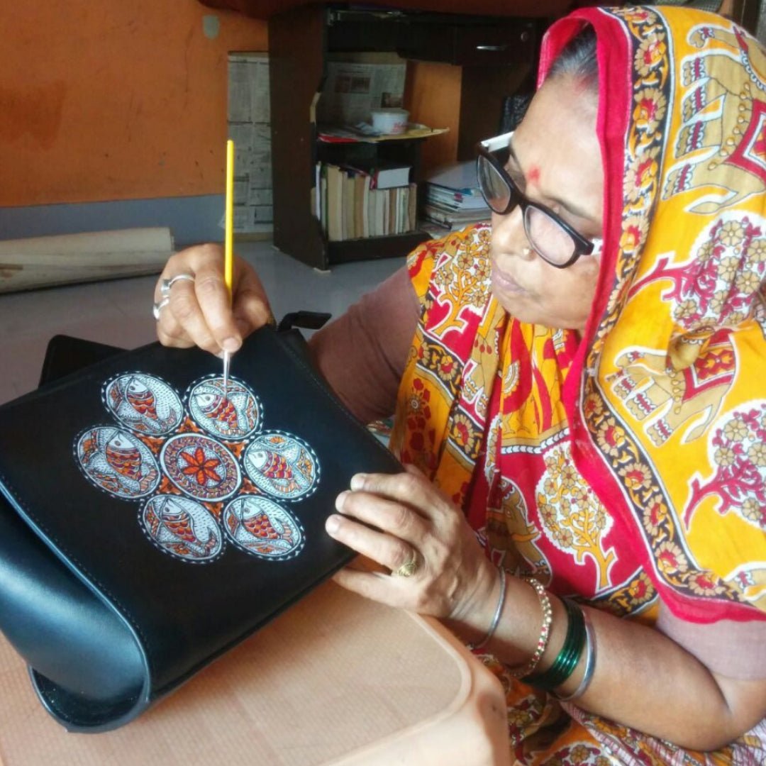 Hand-painted madhubani art on genuine leather handbags by Shant Devi